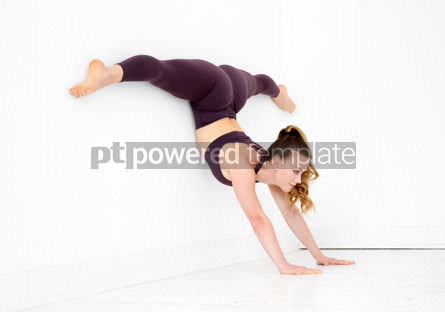 Young Gymnast Doing a Handstand Split Exercise Foto Stok 104957