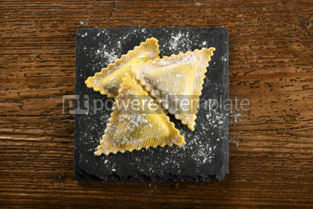 Triangular Fresh Handmade Raw Ravioli Italian Pasta on a Board Photo 110511