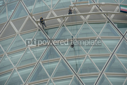 A Rope Operator with a Harness Lowering Himself onto the Facade of a ...