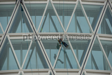 A Rope Operator with a Harness Lowering Himself onto the Facade of a ...