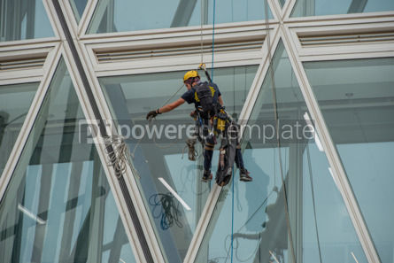 A Rope Operator with a Harness Lowering Himself onto the Facade of a ...